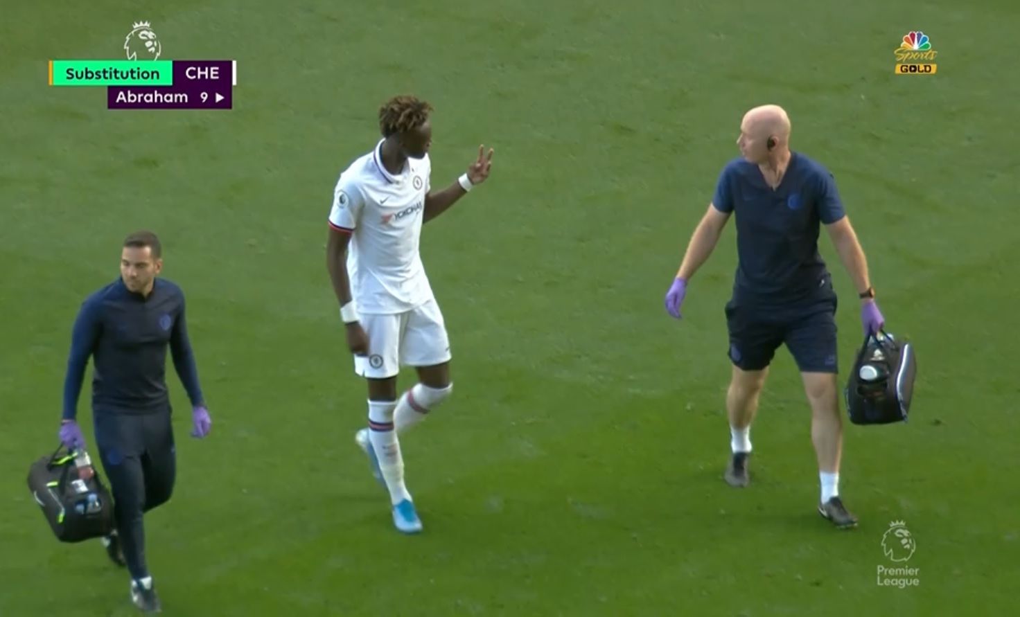 (Image): Abraham sticks fingers up to Wolves fans as he leaves the field